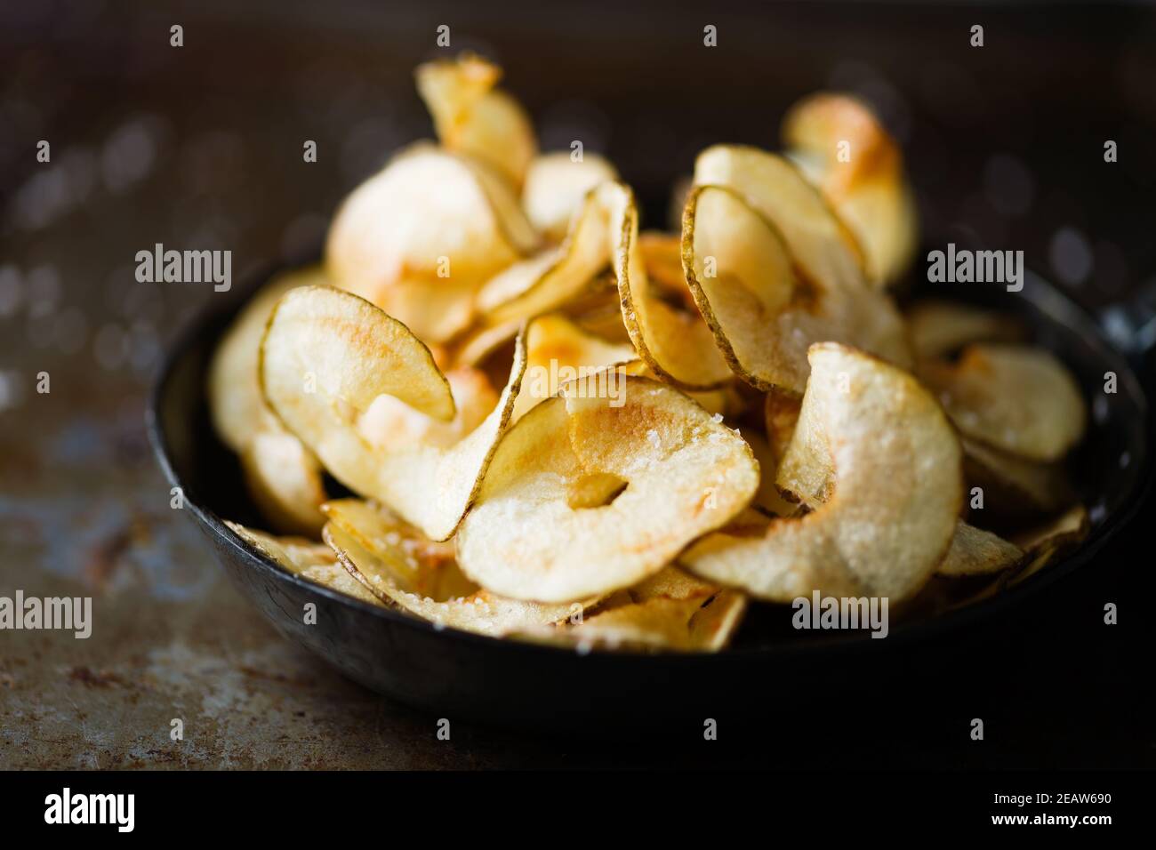rustic english pub grub ribbon cut potato crisps Stock Photo - Alamy