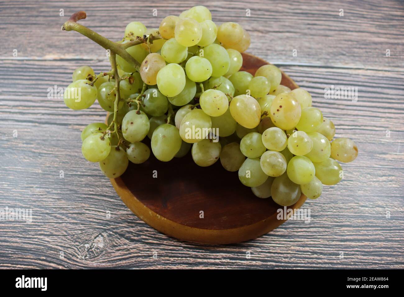 beautiful bunch of white grapes to make wine of good smell and taste ...