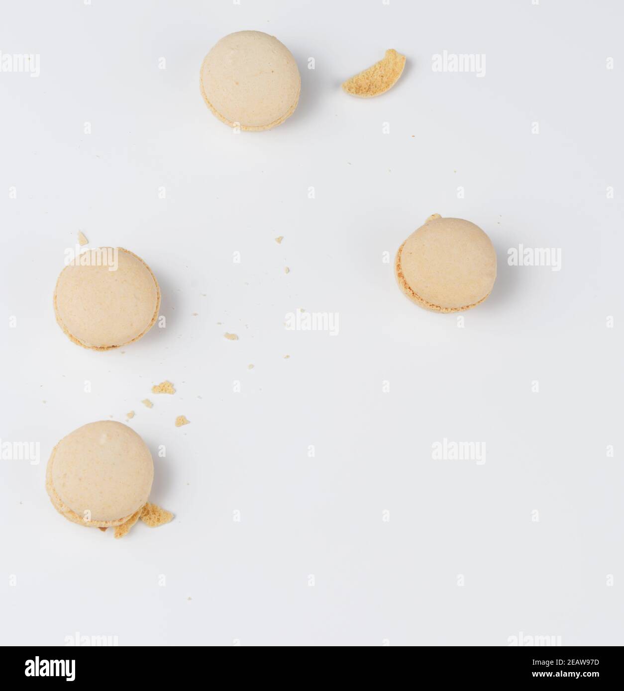 beige baked pasta of almond anguish broken down on a white background ...