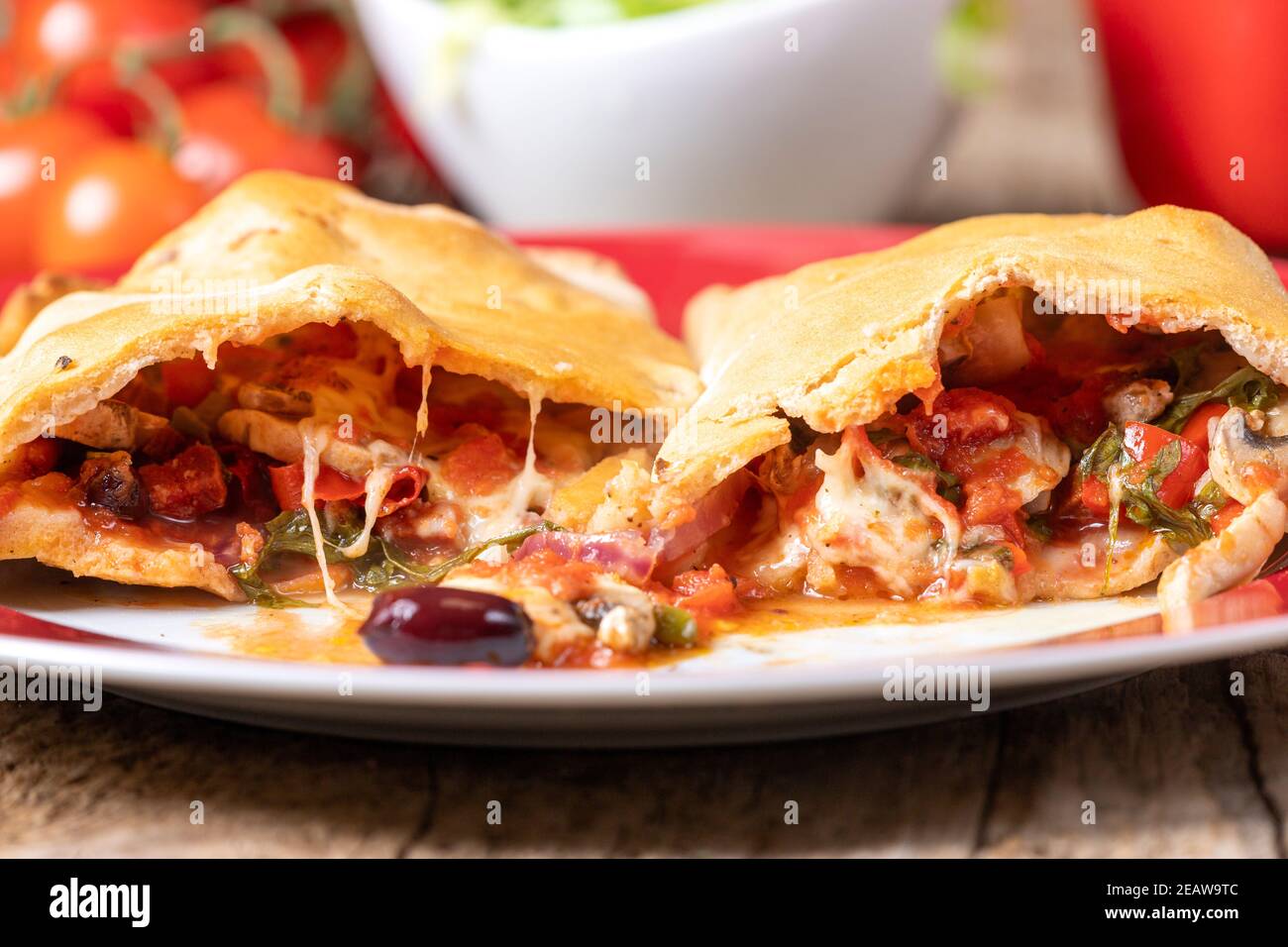 Pizza calzone with chicken and pepper hi-res stock photography and ...