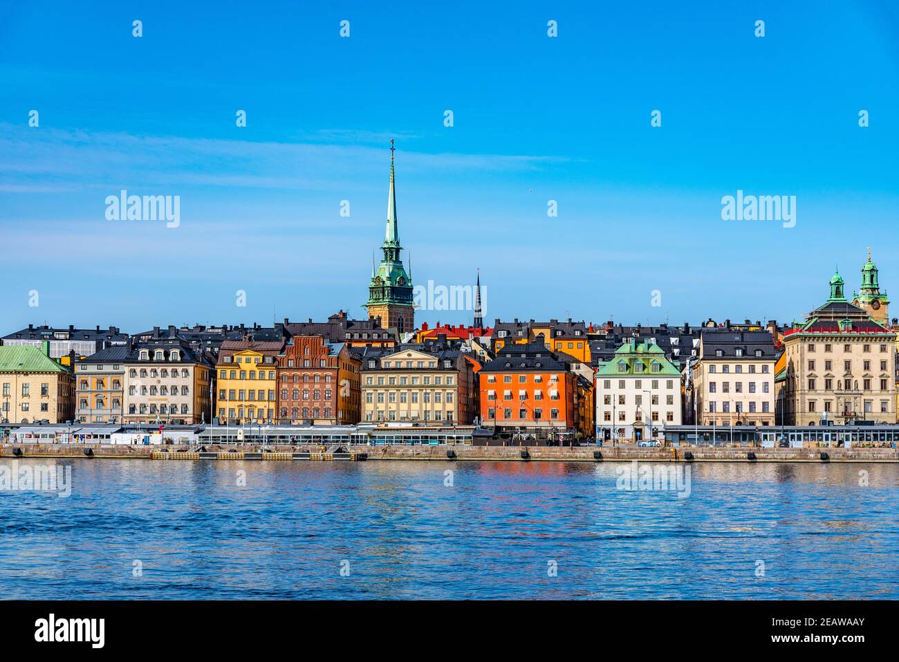 German church and colourful buildings of Gamla Stan in Stockholm viewed ...