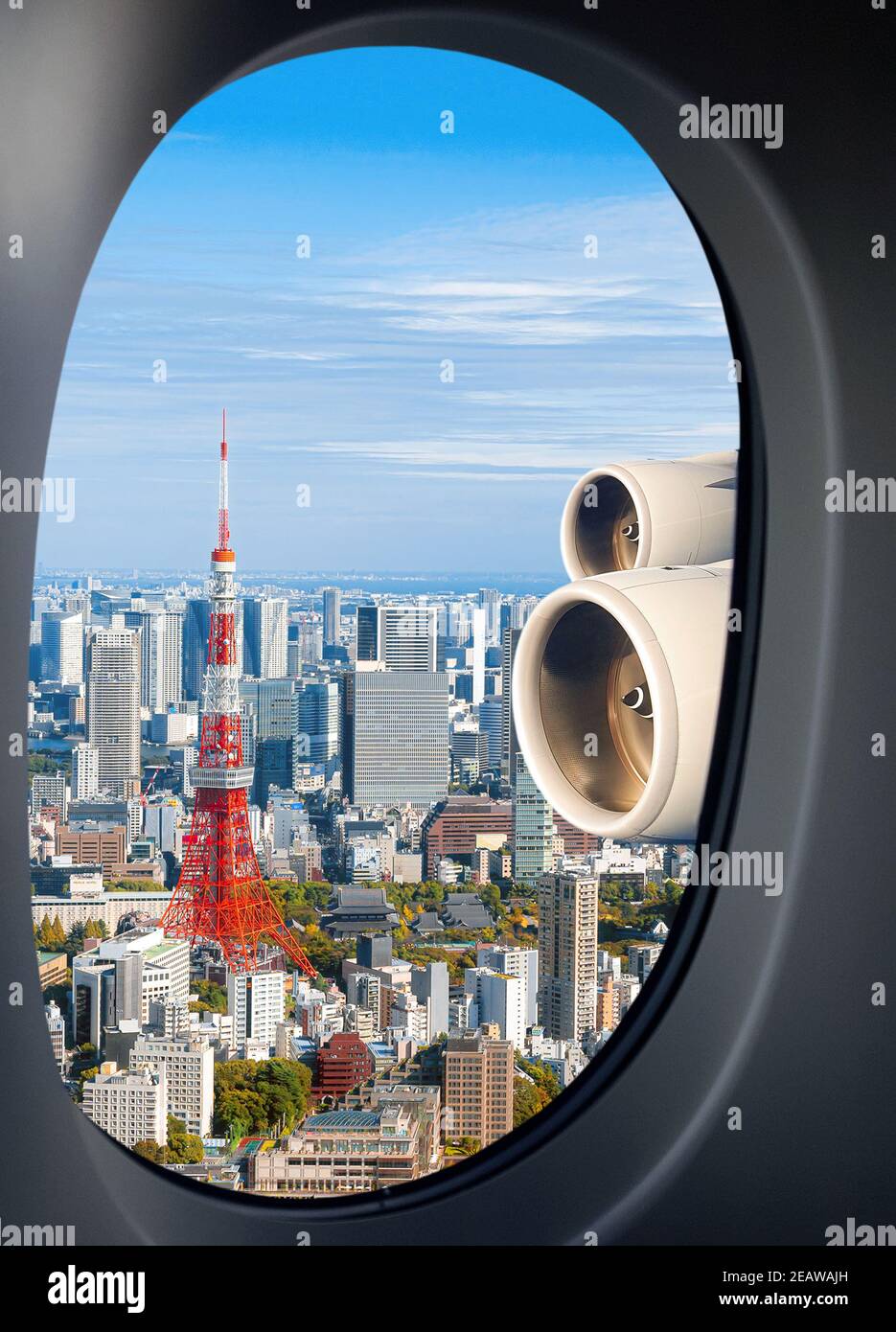 Tokyo city view with Tokyo tower through airplane window Stock Photo ...