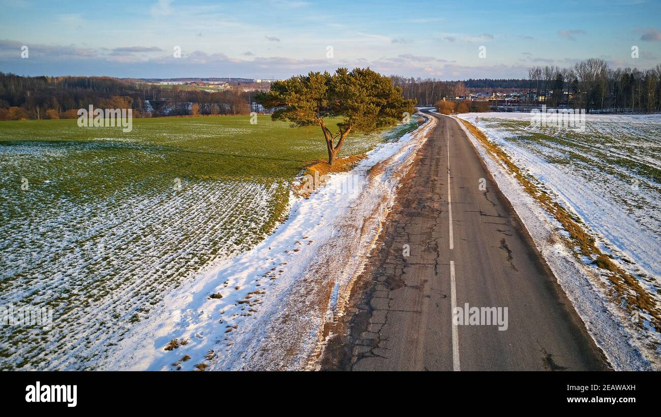 Winter Agricultural field under snow. Countryside road Aerial view ...