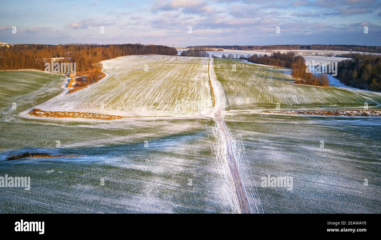 Winter Agricultural field under snow. Aerial scene. December Rural ...