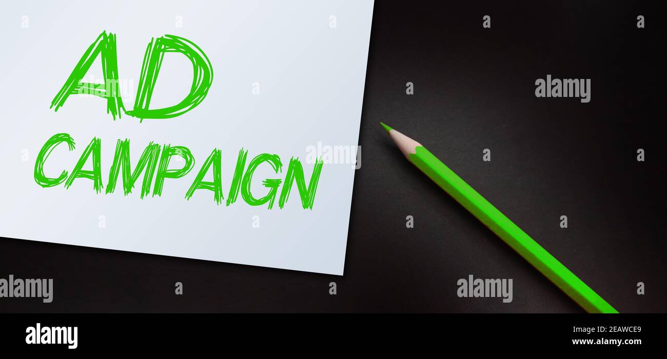Pencil writing the word s Ad campaign. Advertising marketing concept ...