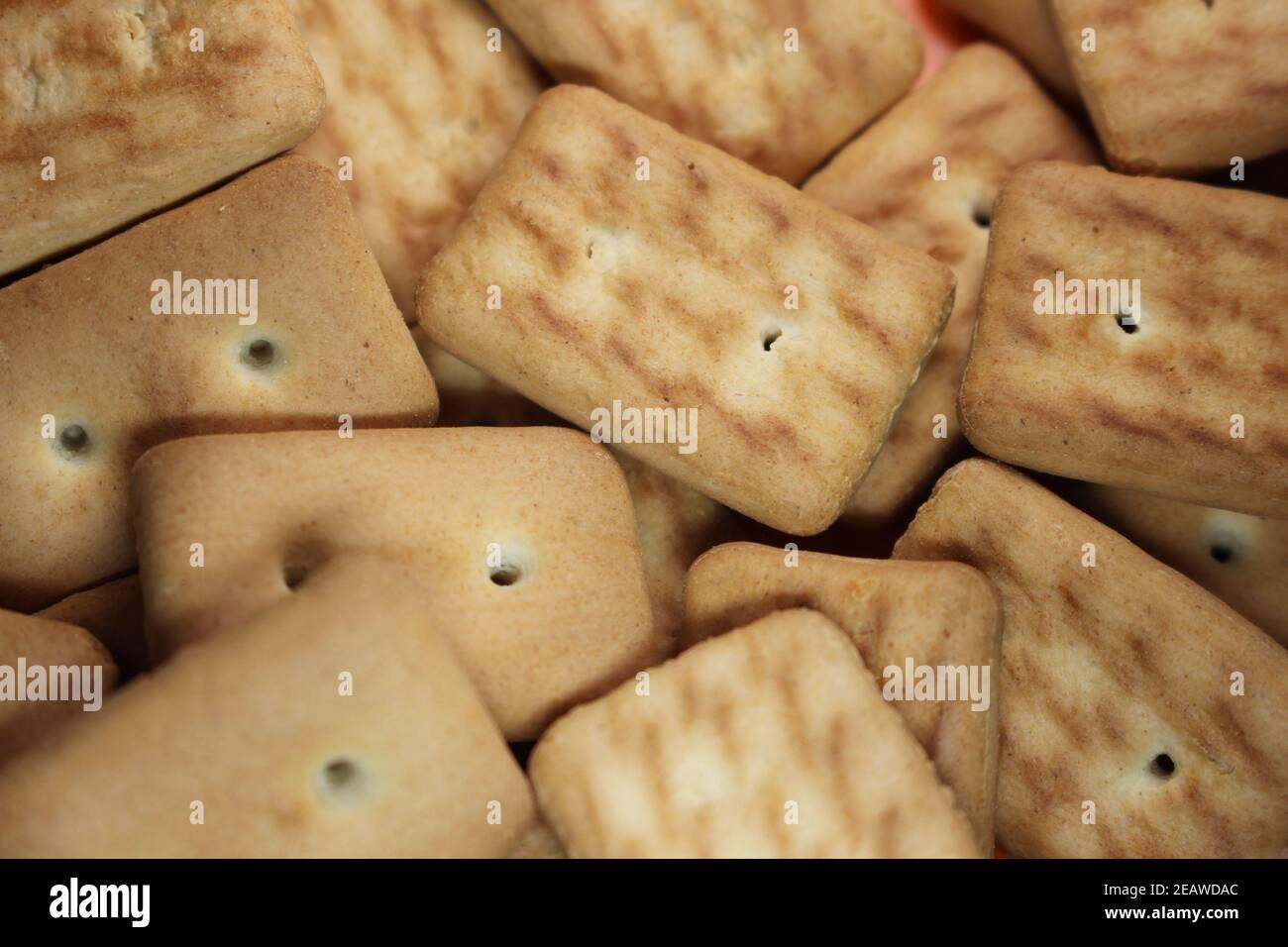 Close up view rectangular biscuits with small pores Stock Photo - Alamy