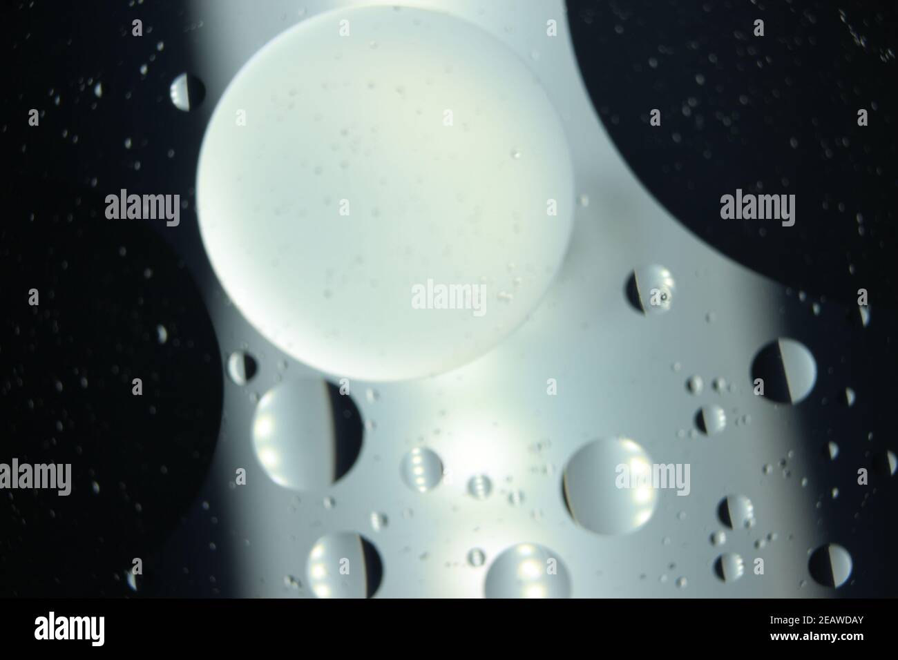 abstract macro background of oil circles floating over water surface ...
