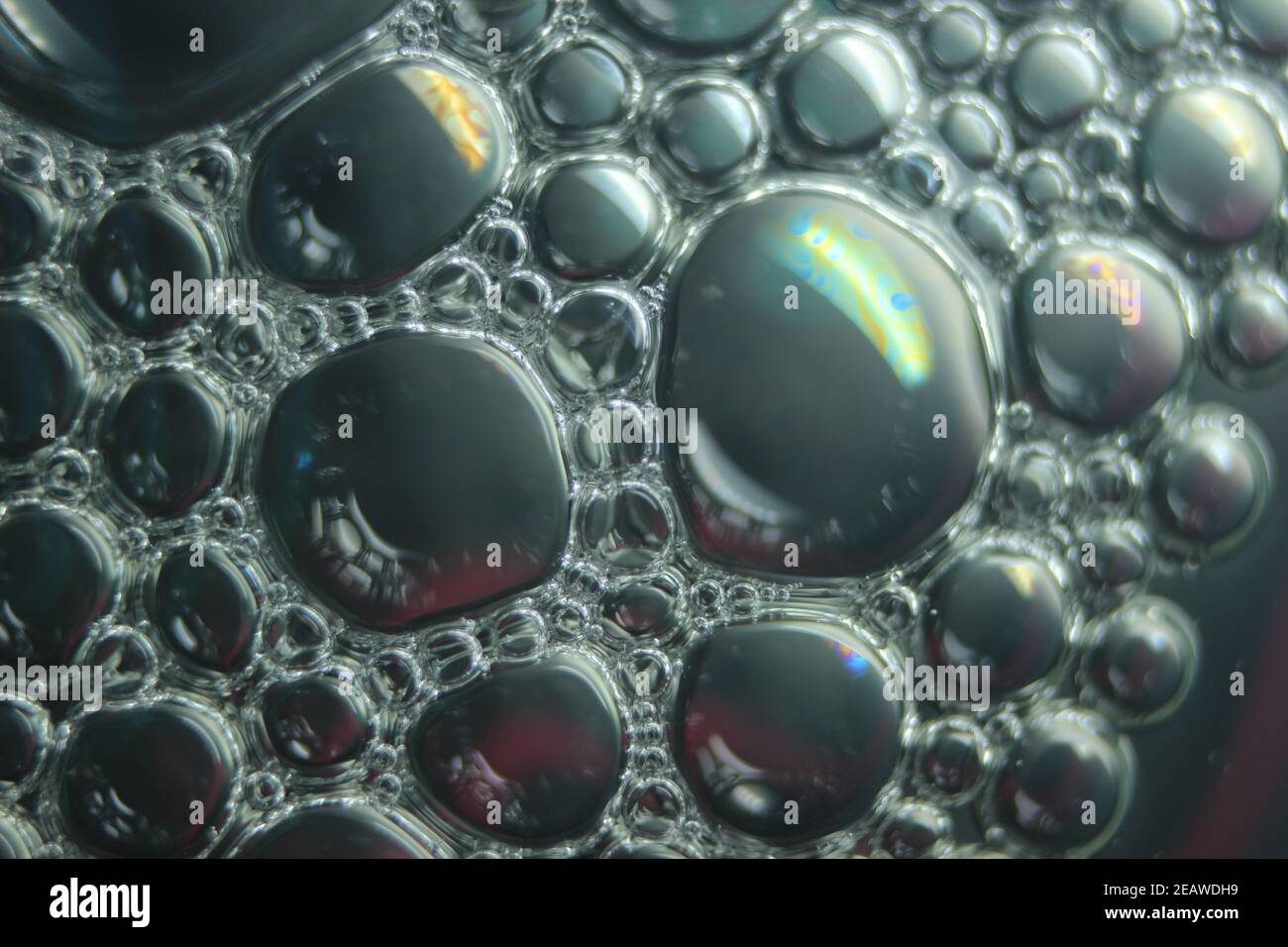 abstract macro background of oil circles floating over water surface ...