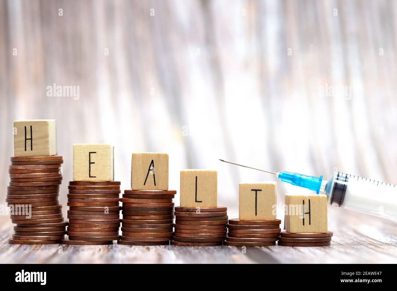 Word HEALTH on step stacked coins with syringe for injection, Money ...