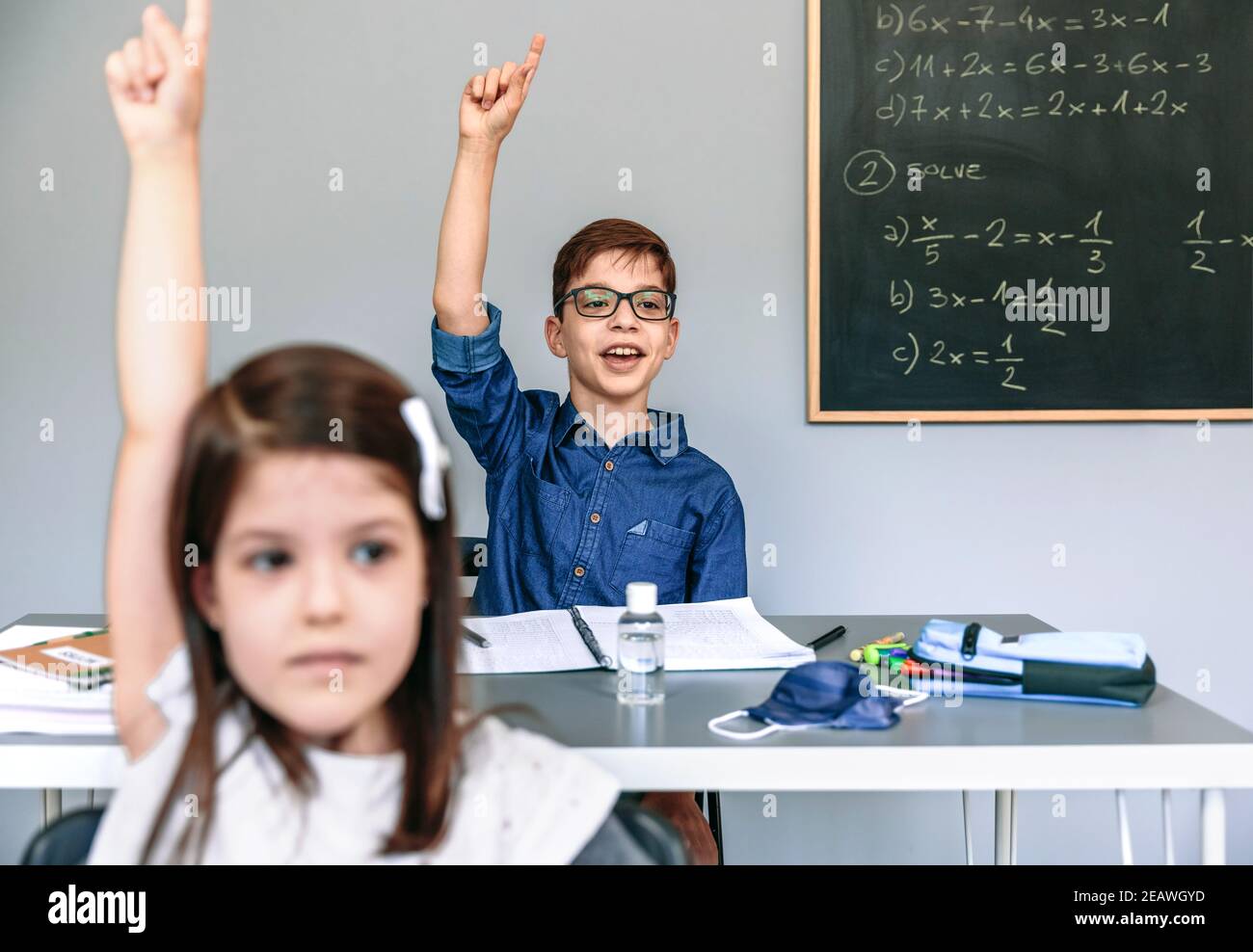 Child raising hand class hi-res stock photography and images - Alamy