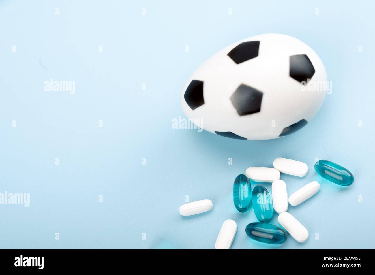 Football soccer ball as easter egg with medicine pills and dietary ...