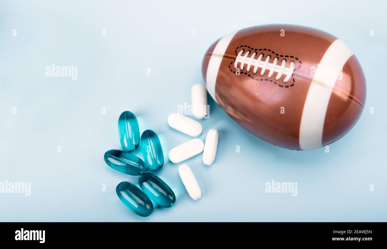 Sport equipment, Egg in the form of a football ball with medicine pills ...