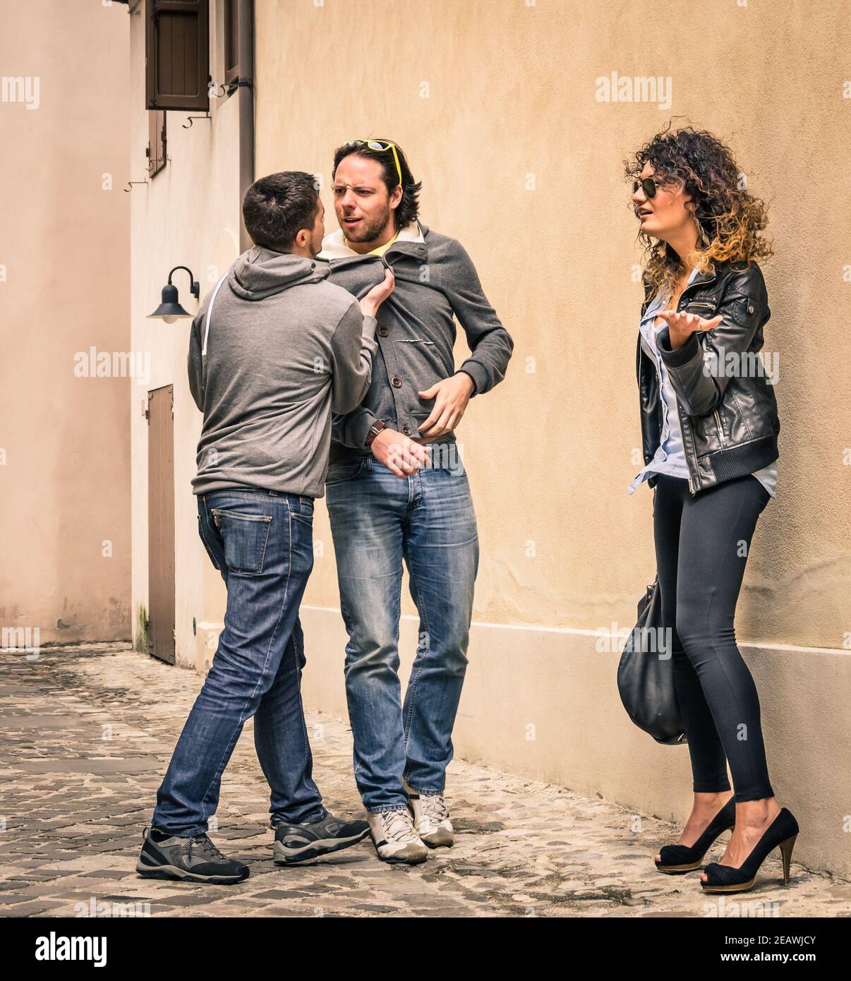 Three fighting men hi-res stock photography and images - Alamy