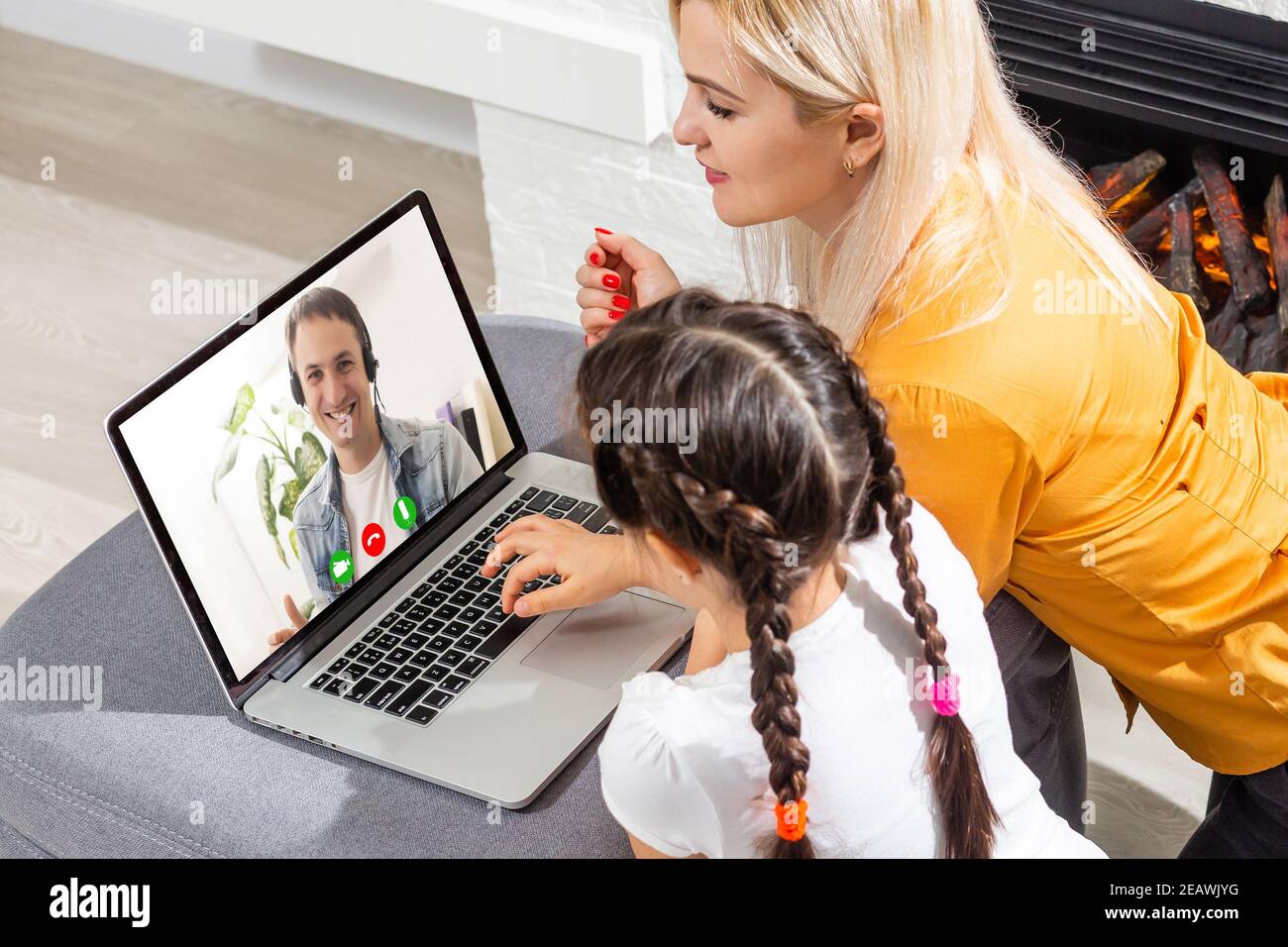 Smart small preschooler girl watch online lesson and communicate with ...