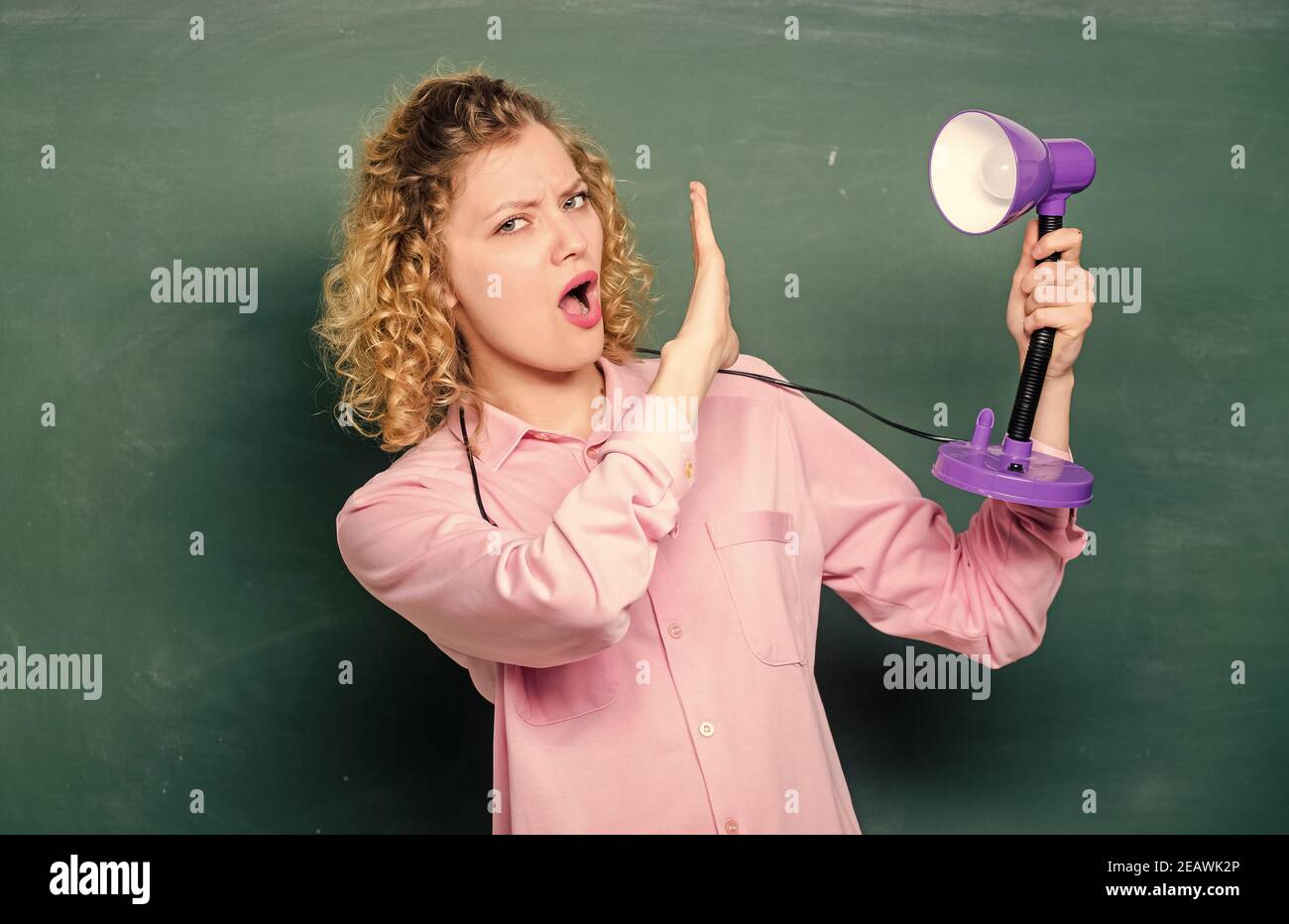 ray of light. education concept. back to school. teacher with lamp at ...