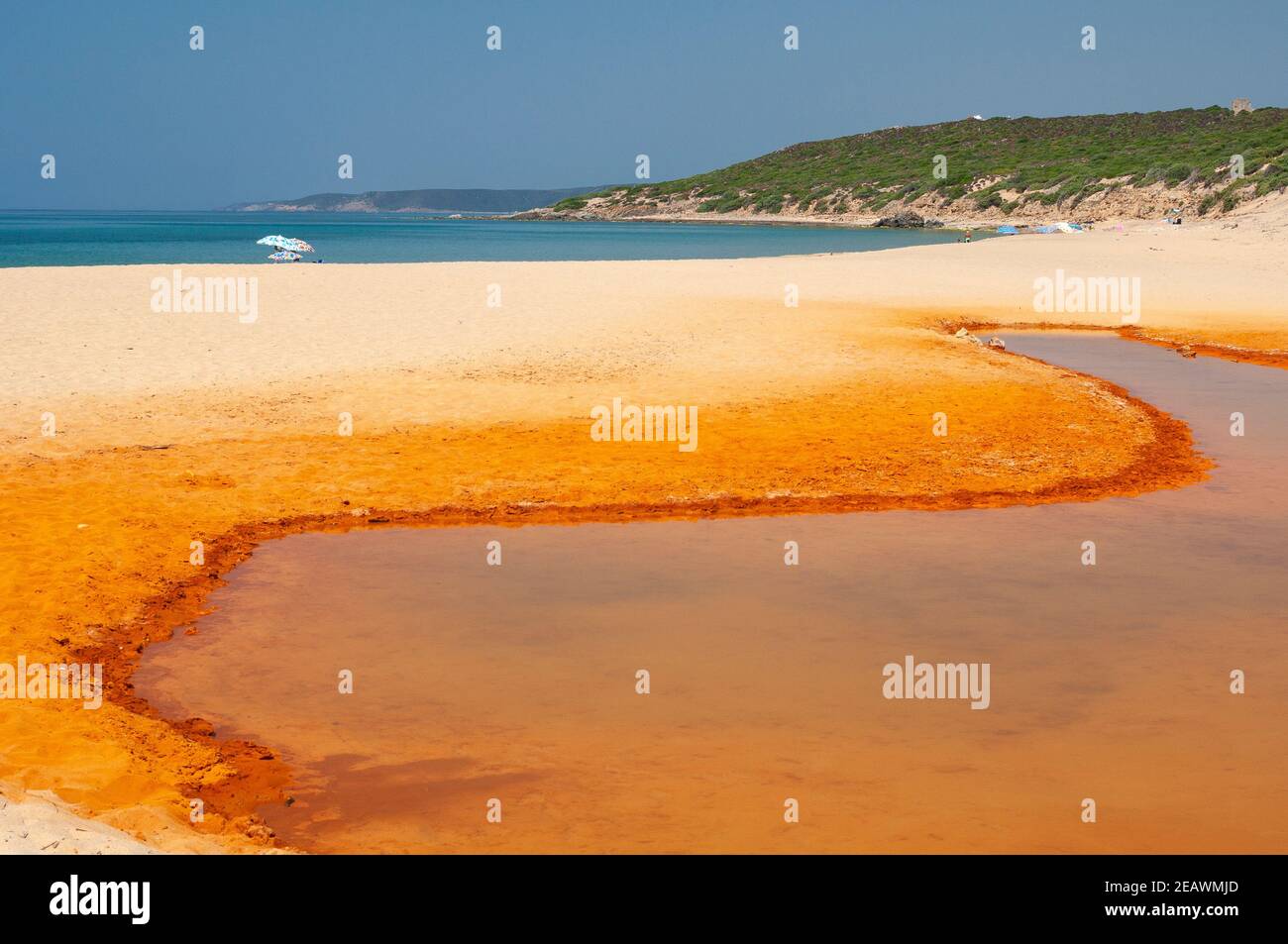 large golden sand dunes and crystal clear water at Piscinas beach Stock ...