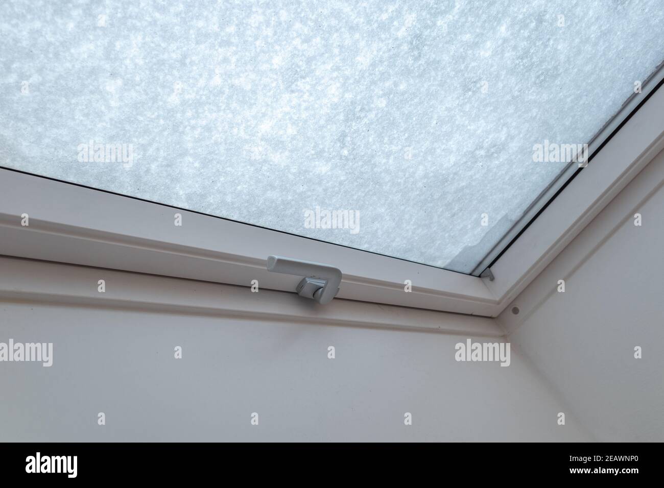 Selective focus and interior view through skylight with thick layer of ...