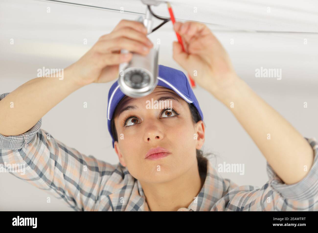 Cctv watching woman hi-res stock photography and images - Alamy
