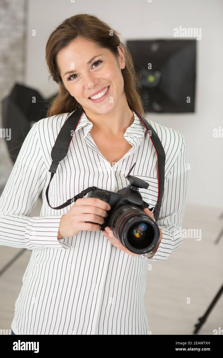 woman photographer is posing with digital photo camera Stock Photo - Alamy