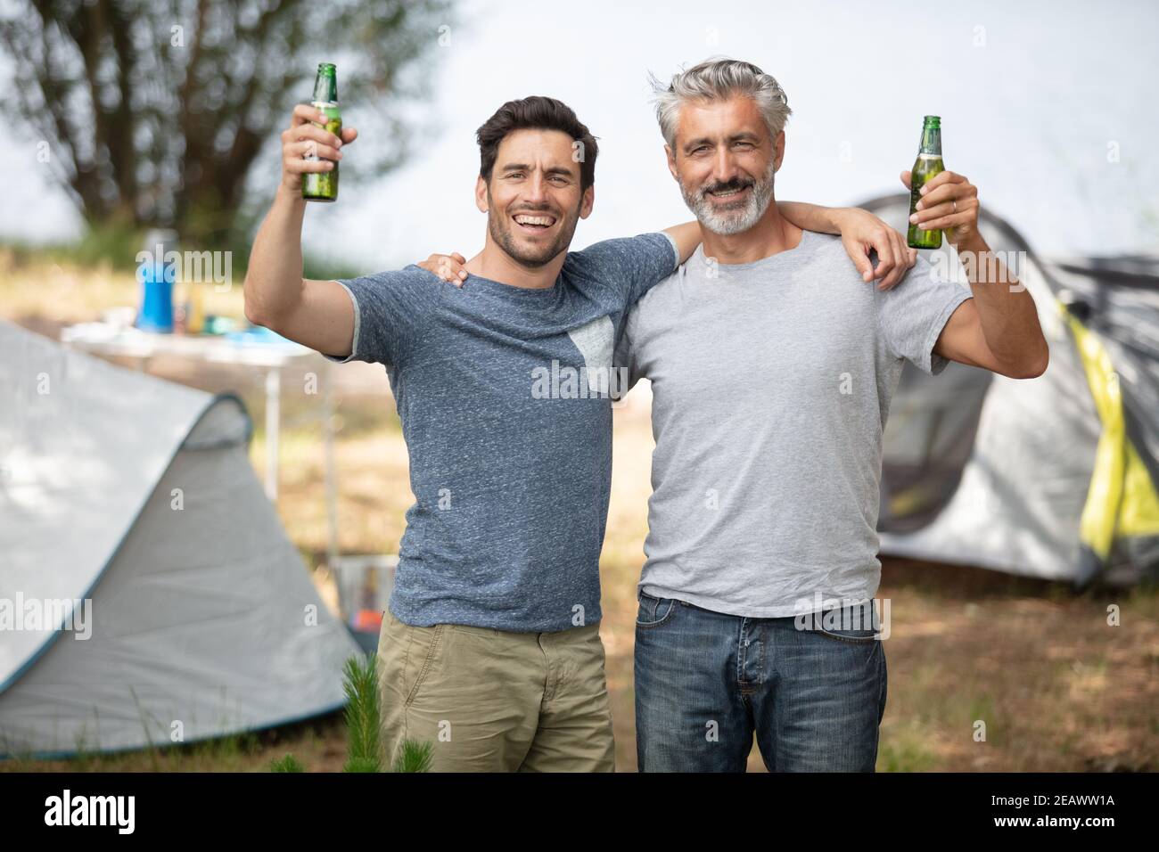 happy young male friends having picnic Stock Photo - Alamy