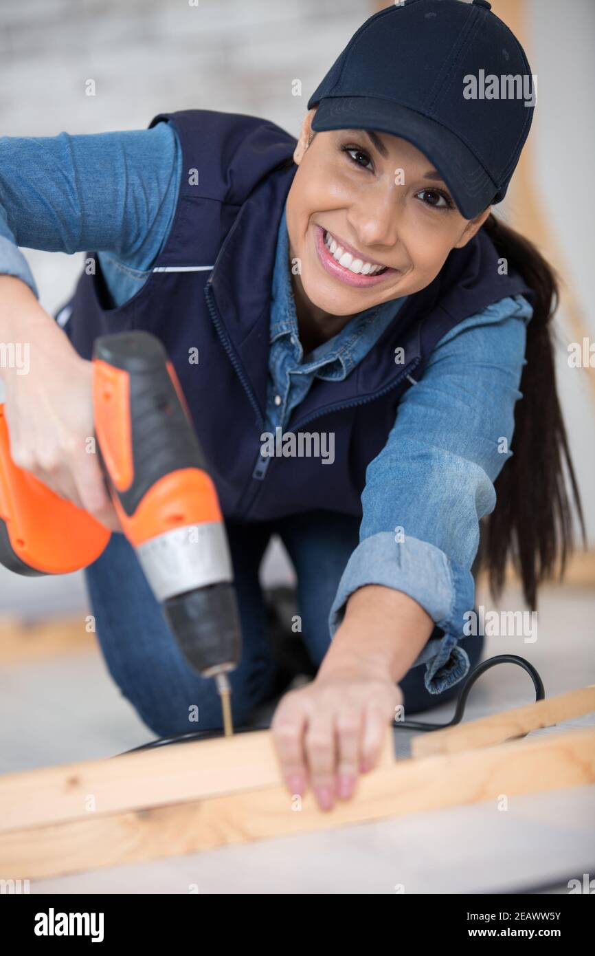 beautiful young woman carpenter at work Stock Photo - Alamy