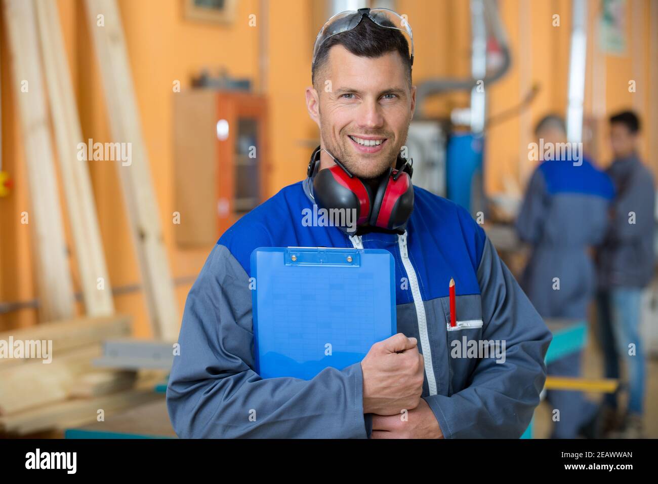woodworking workshop supervisor smiling and posing Stock Photo - Alamy