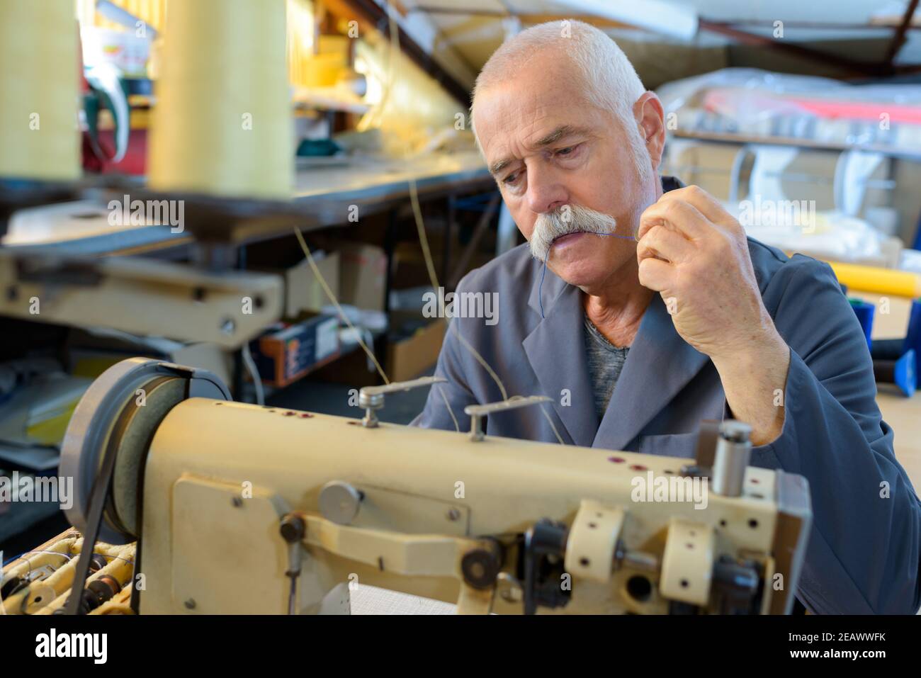 a senior using sewing machine Stock Photo - Alamy