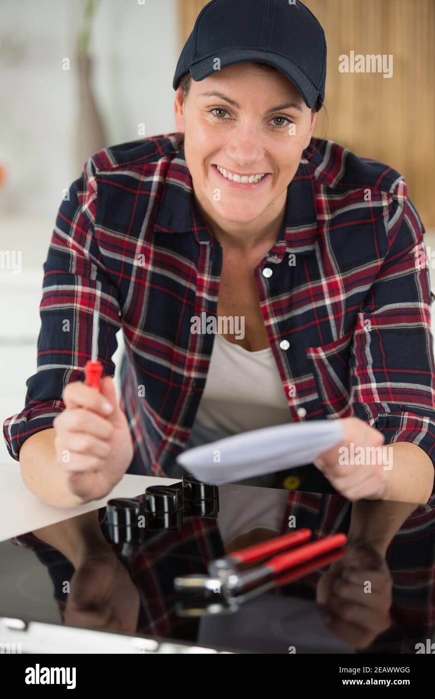 happy female worker smiling at the camera Stock Photo - Alamy