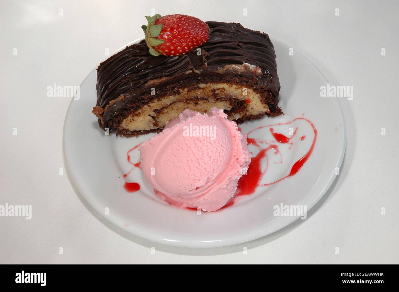 Slice of cake with ice cream Stock Photo - Alamy
