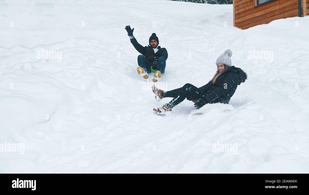 Woman sliding snow sled hi-res stock photography and images - Alamy
