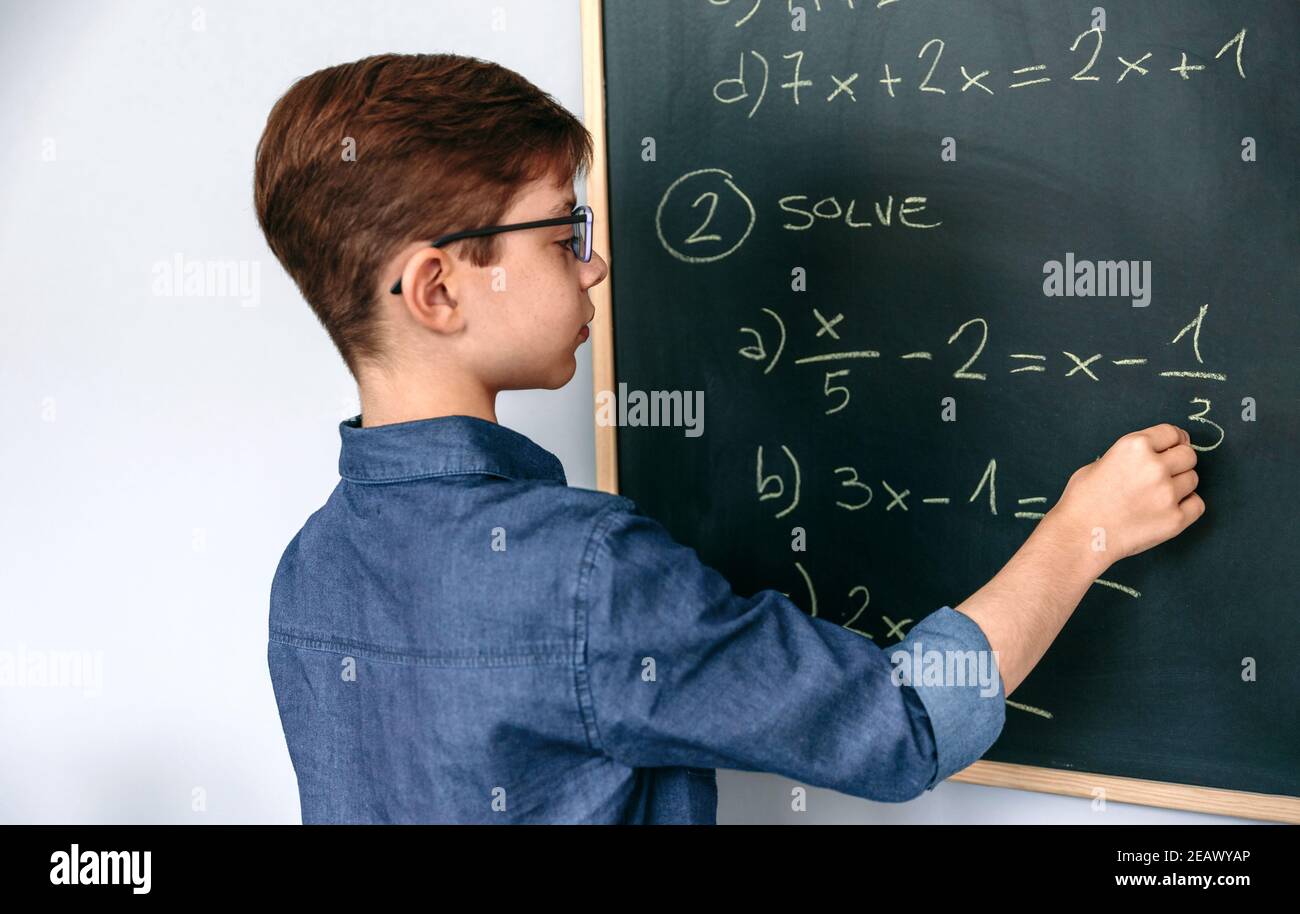 Math problem boy hi-res stock photography and images - Alamy