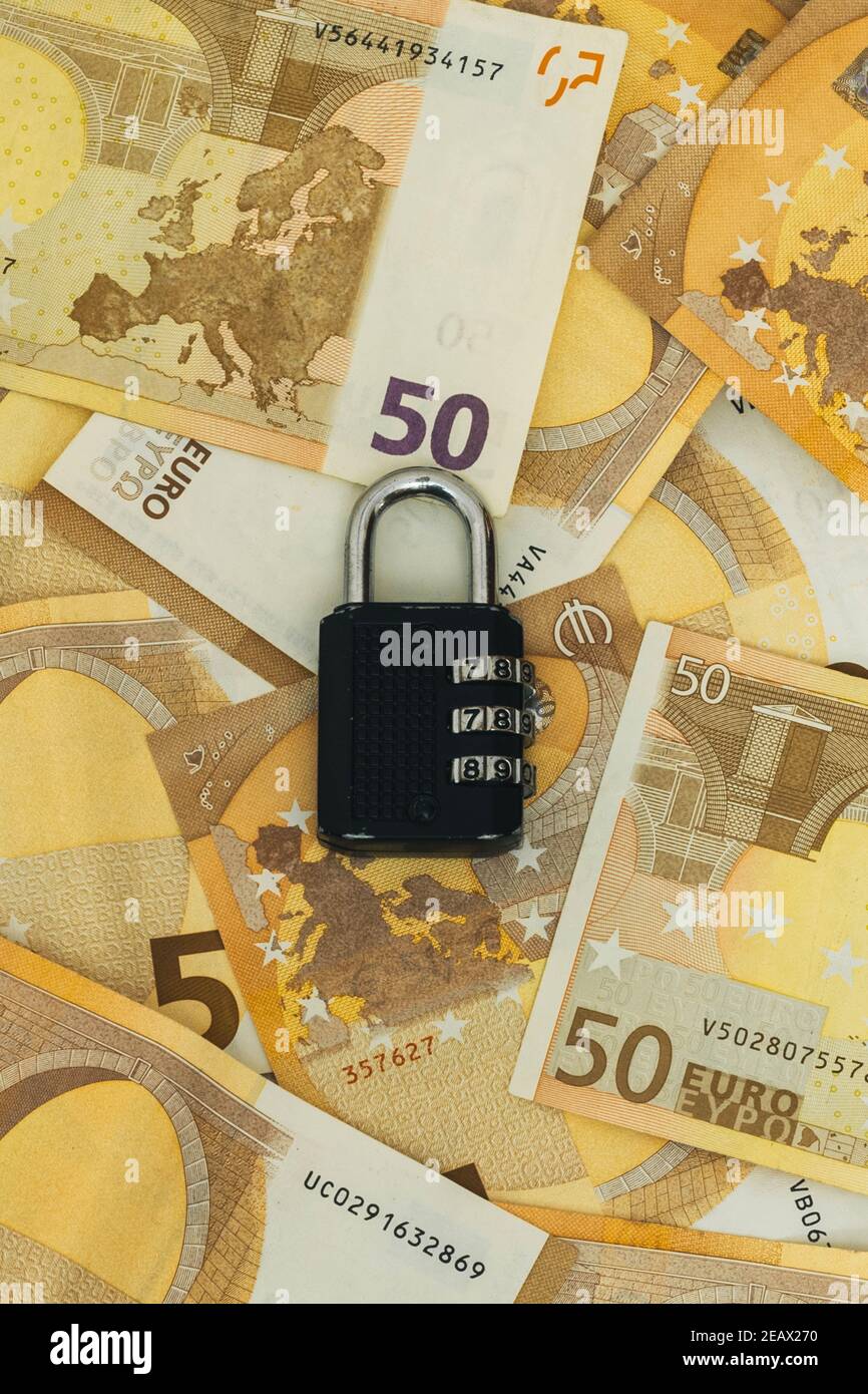 vertical photo of a background of fifty-euro banknotes with a closed ...