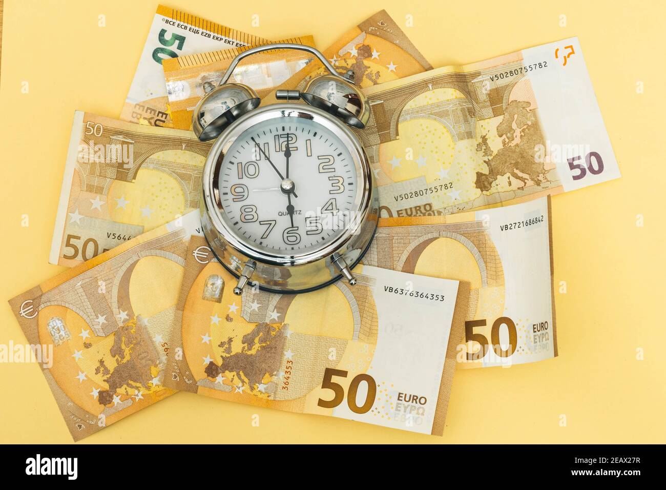 horizontal photo of a background of fifty euro banknotes and an ...