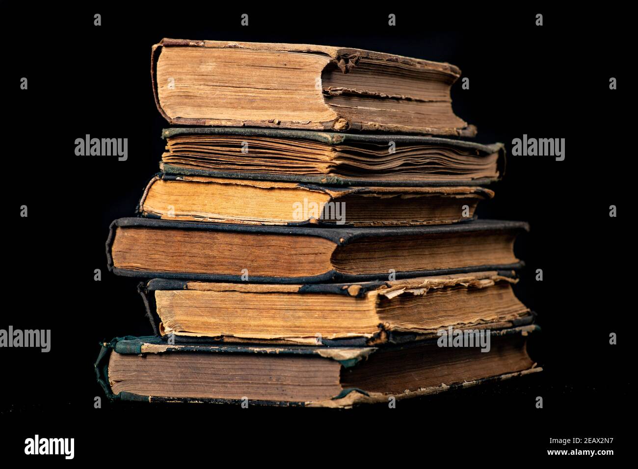 A stack of old books. Paper publications from the old library. Dark ...