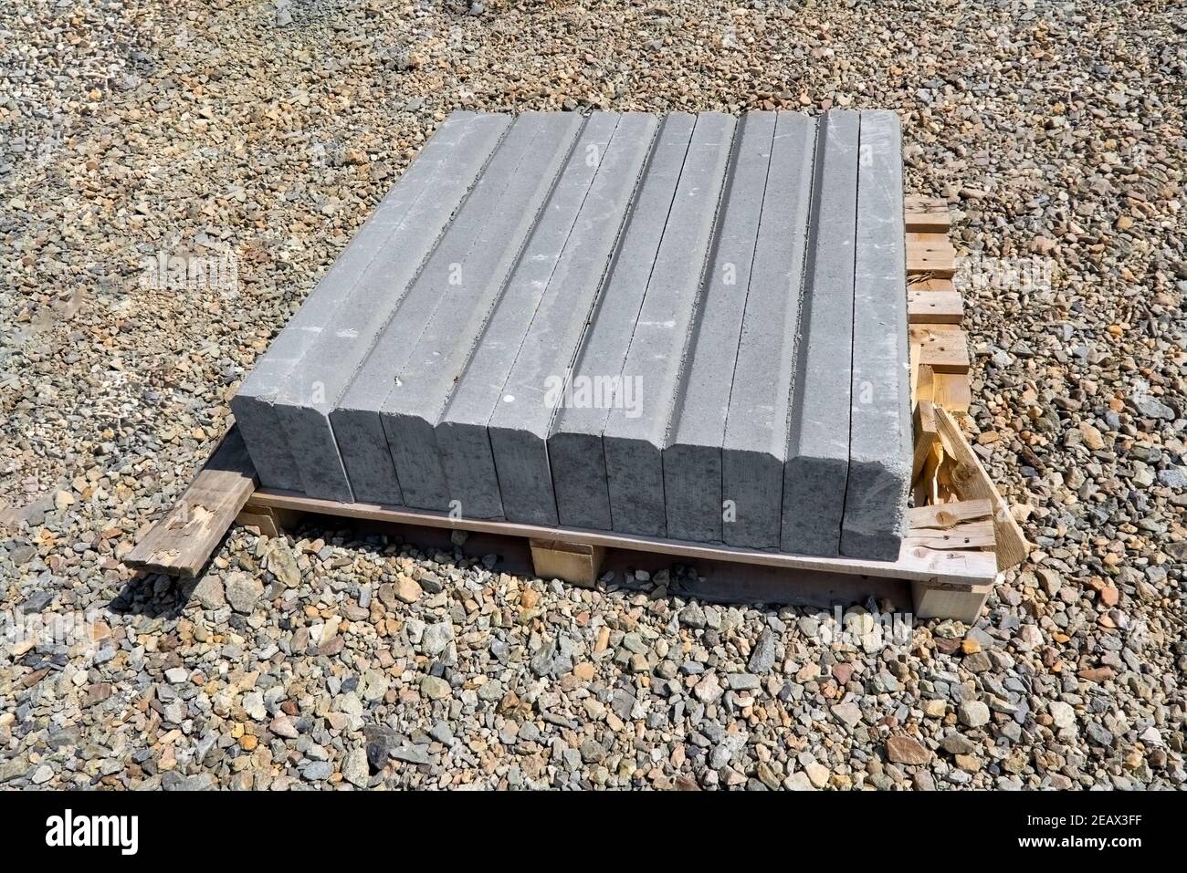 Pallet with concrete curbs for sidewalk construction. Concrete blocks ...
