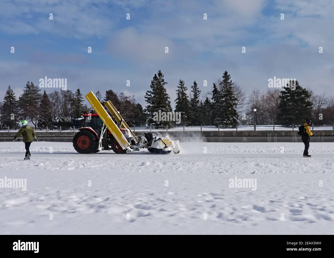 Skaters makes way for the snow plow cleaning up the skating surface on ...