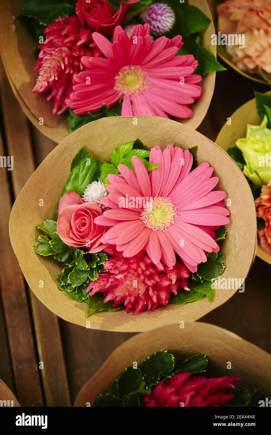 Vertical top view of beautiful bouquets with pink gerberas and roses ...