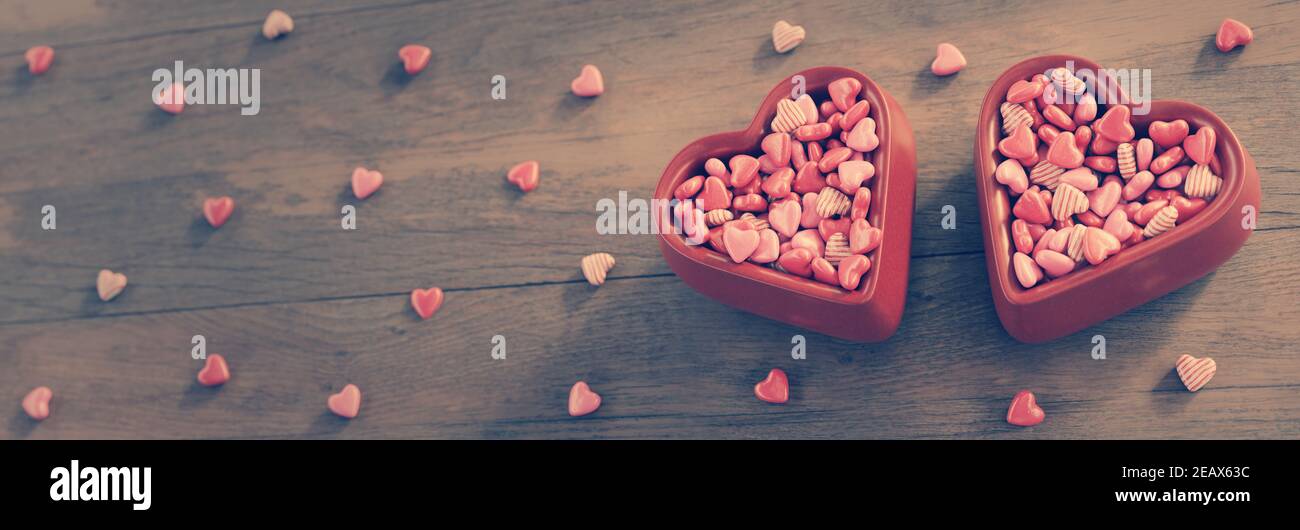 Candy hearts in heart bowls - Panoramic - Retro Stock Photo - Alamy
