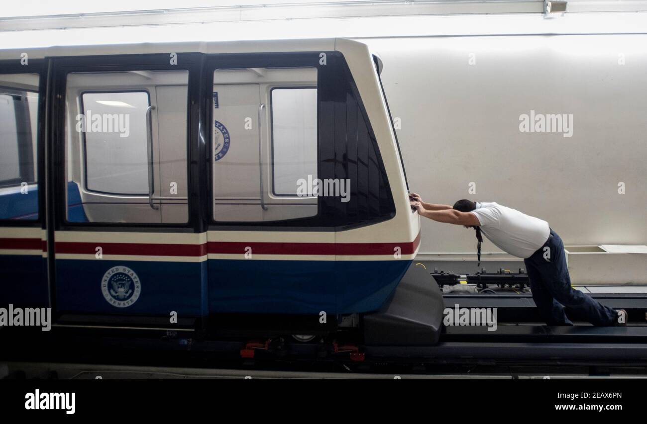 Washington, United States Of America. 10th Feb, 2021. A worker pushes a ...