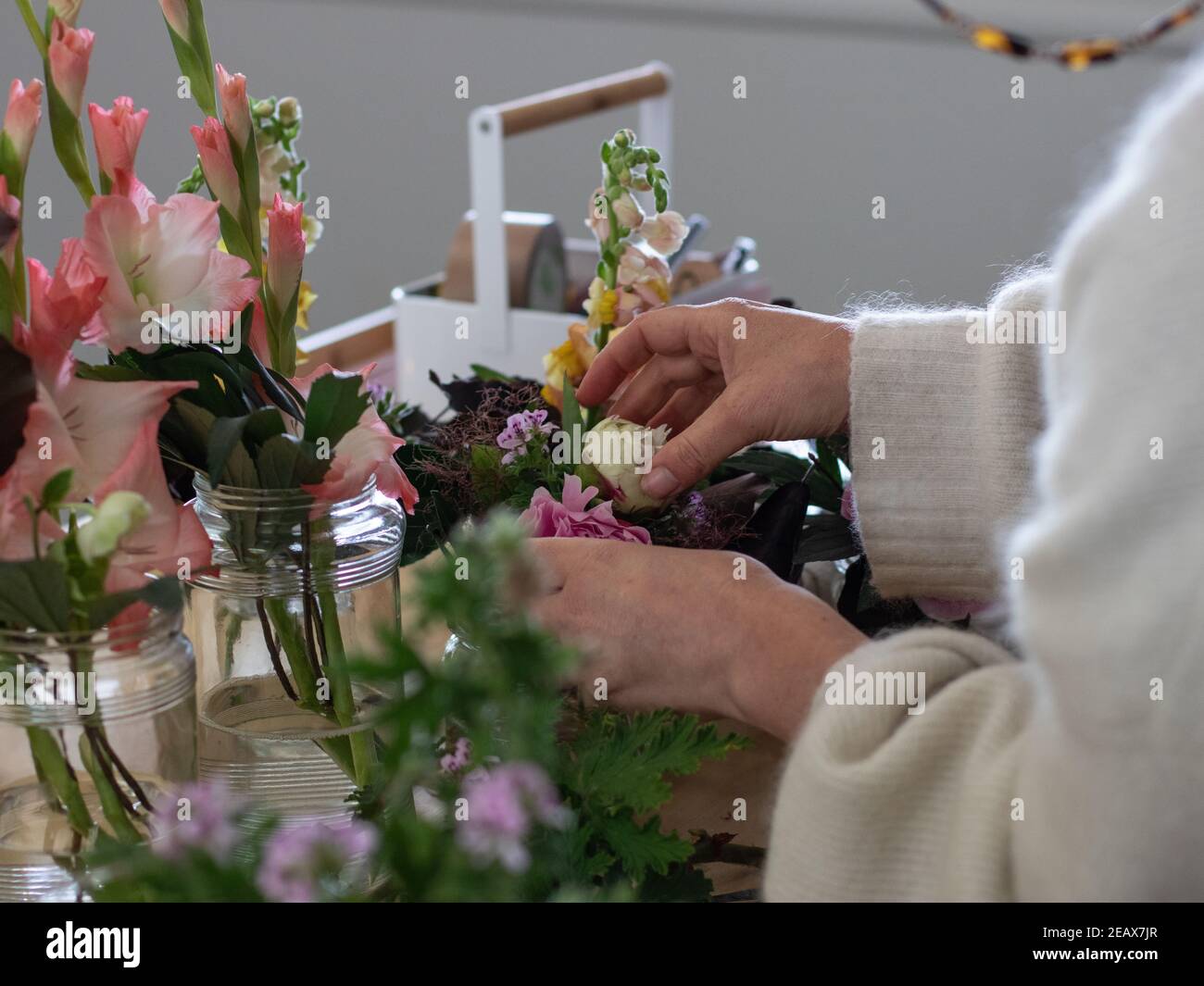 florist hands at work making a floral bouquet Stock Photo - Alamy