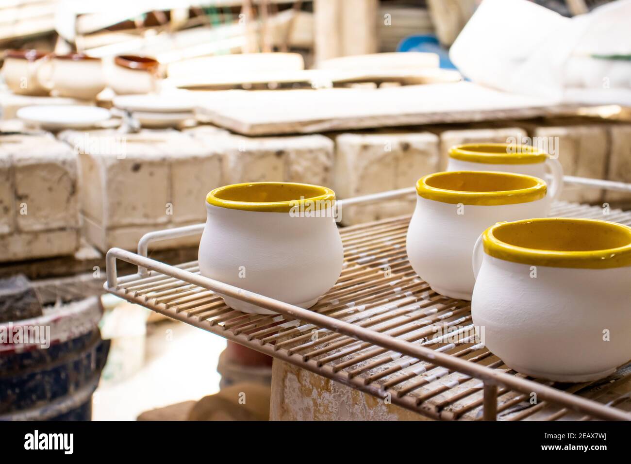 Clay injection molding technique in a traditional ceramics factory at ...
