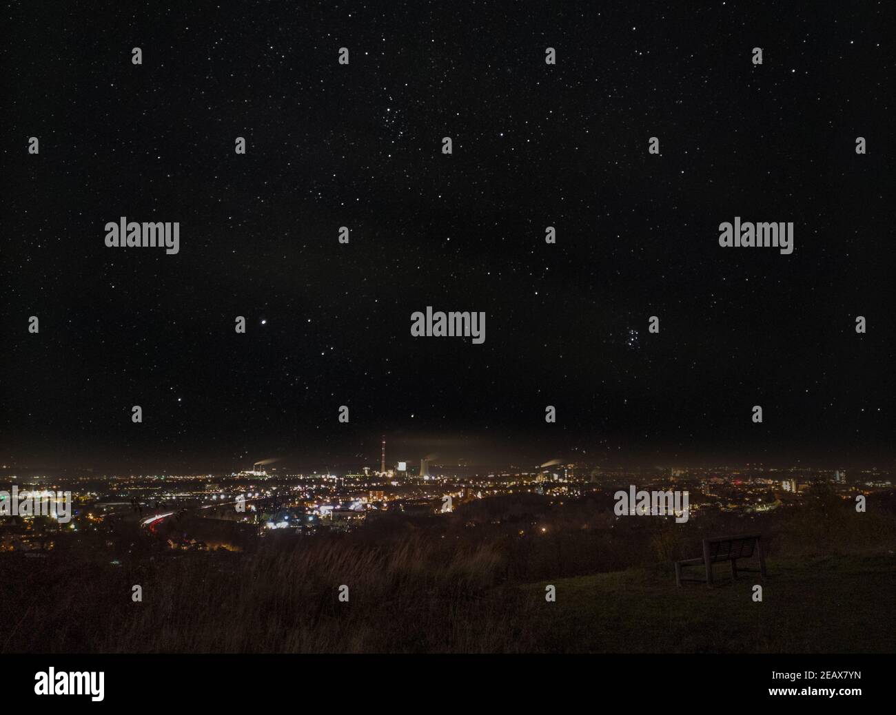 Mesmerizing view of a city gleaming under the starry night sky - great ...