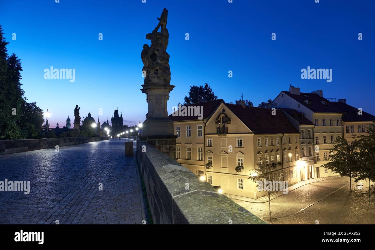 Prague at night, illuminated historical houses and Charles Bridge at ...