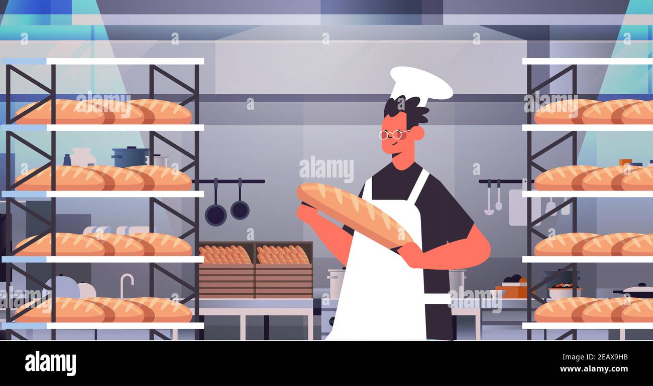 male baker in uniform holding bread bakery products baking manufacture ...