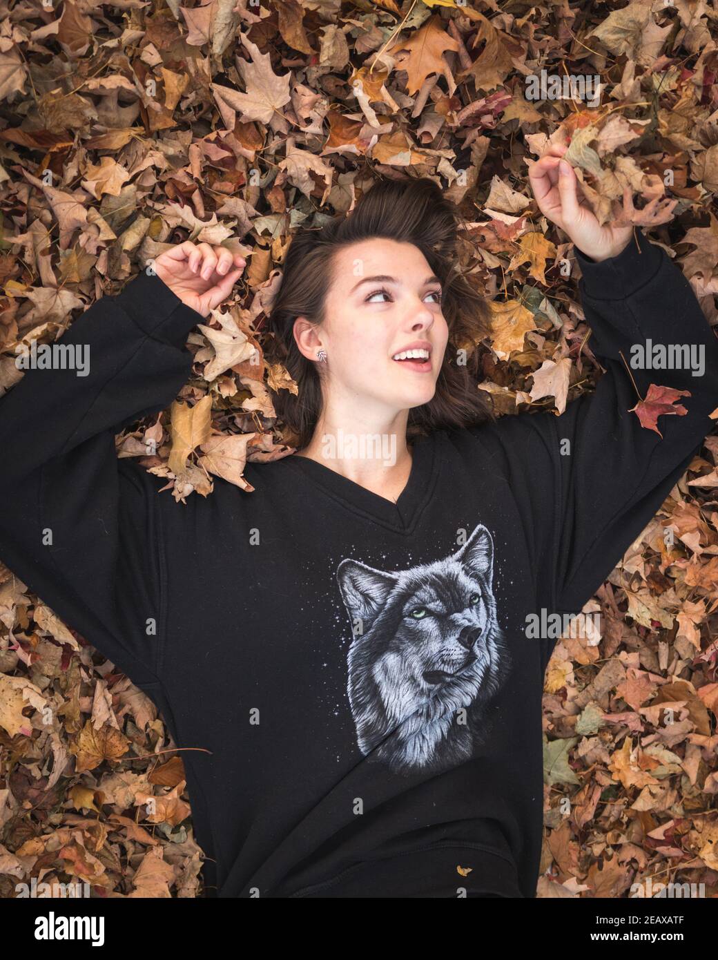 Beautiful girl falling leaves colors hi-res stock photography and ...