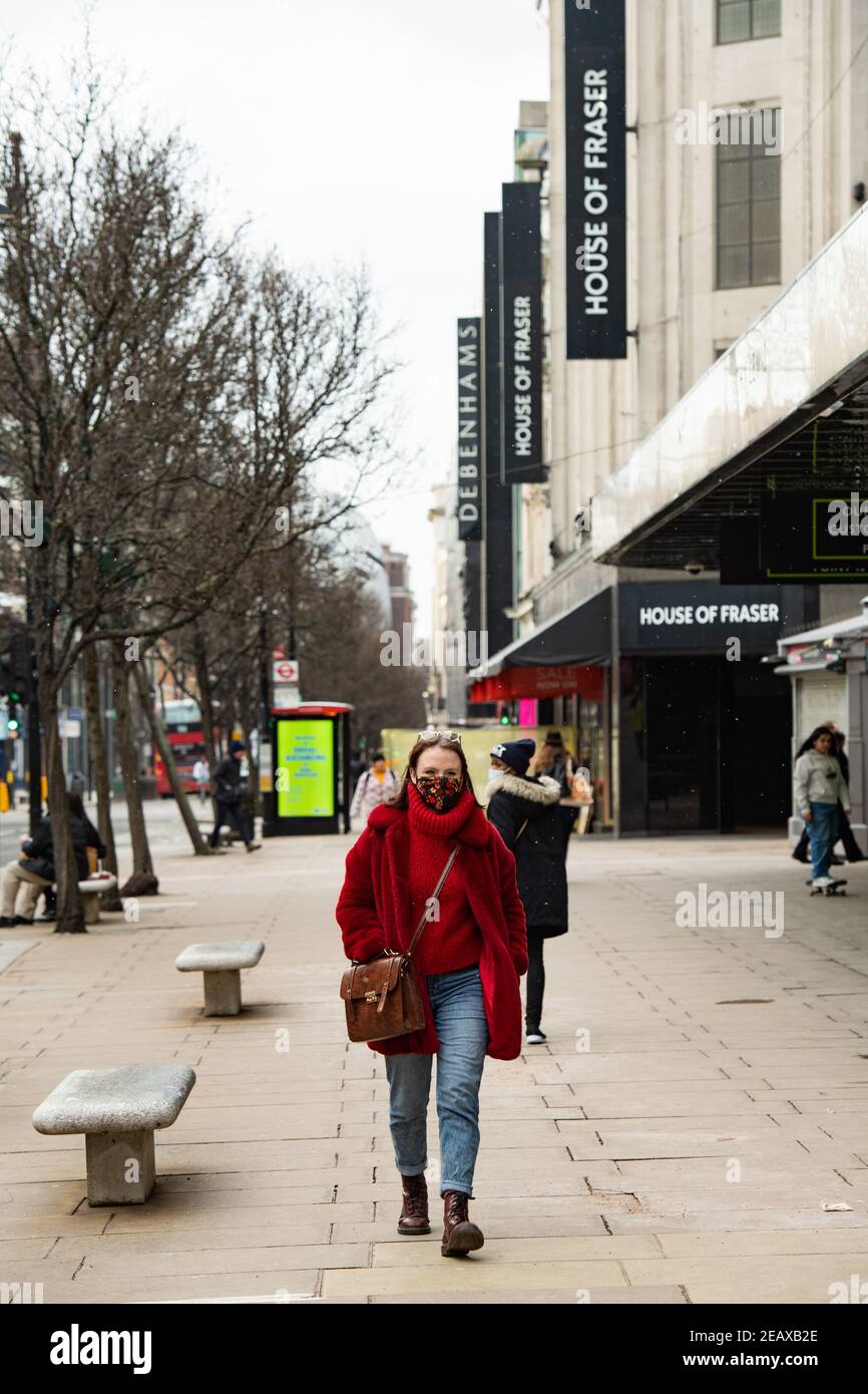 Shopper with face mask on Oxford Street, London out side House of ...