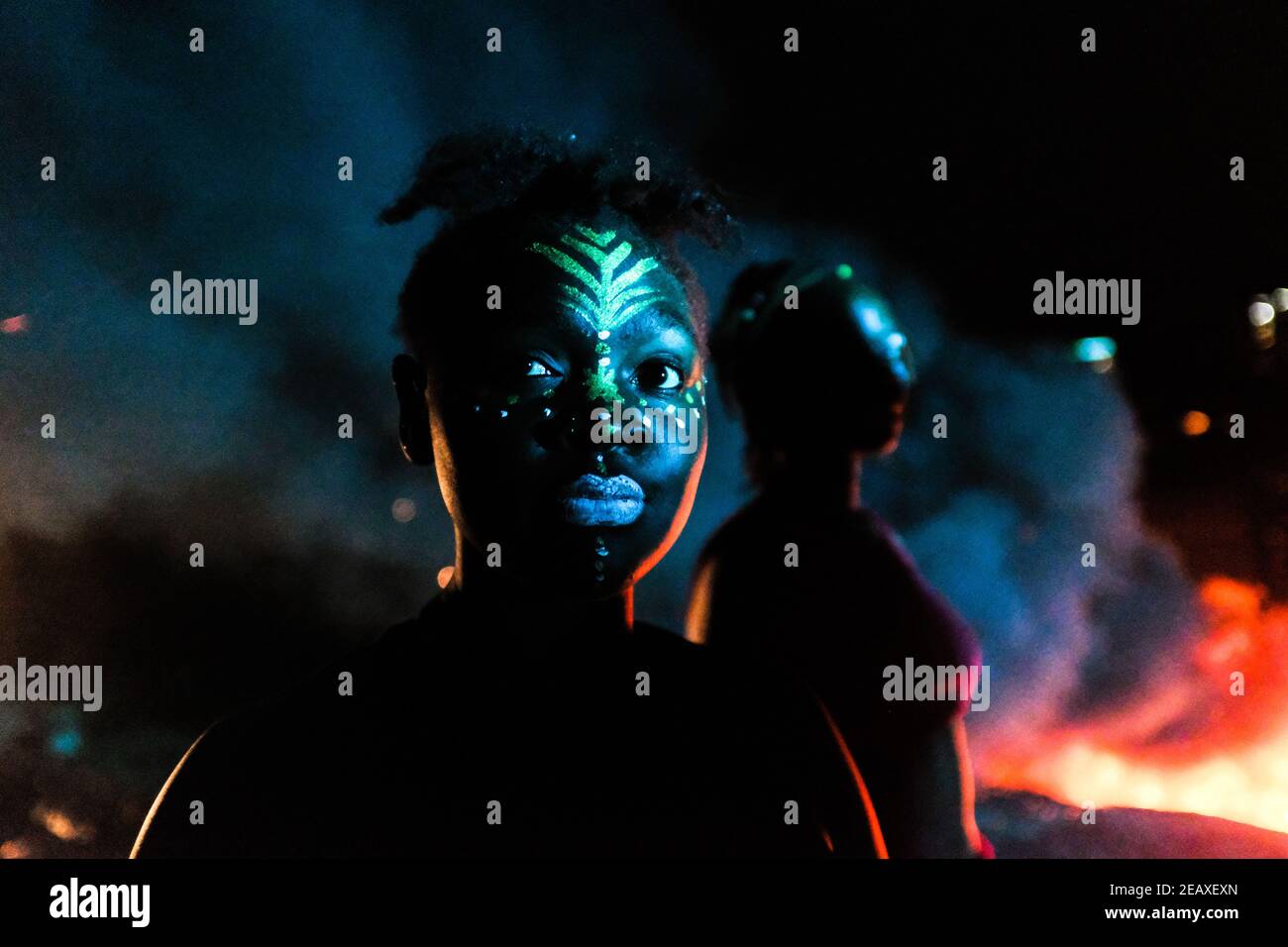 A female dancer is seen face painted during a Video Production of ...