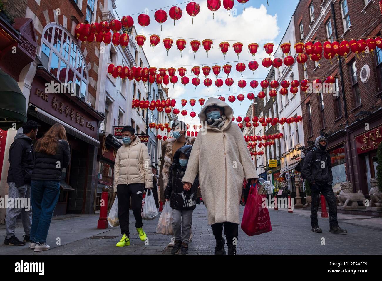 People wearing face masks as a preventive measure against the spread of ...