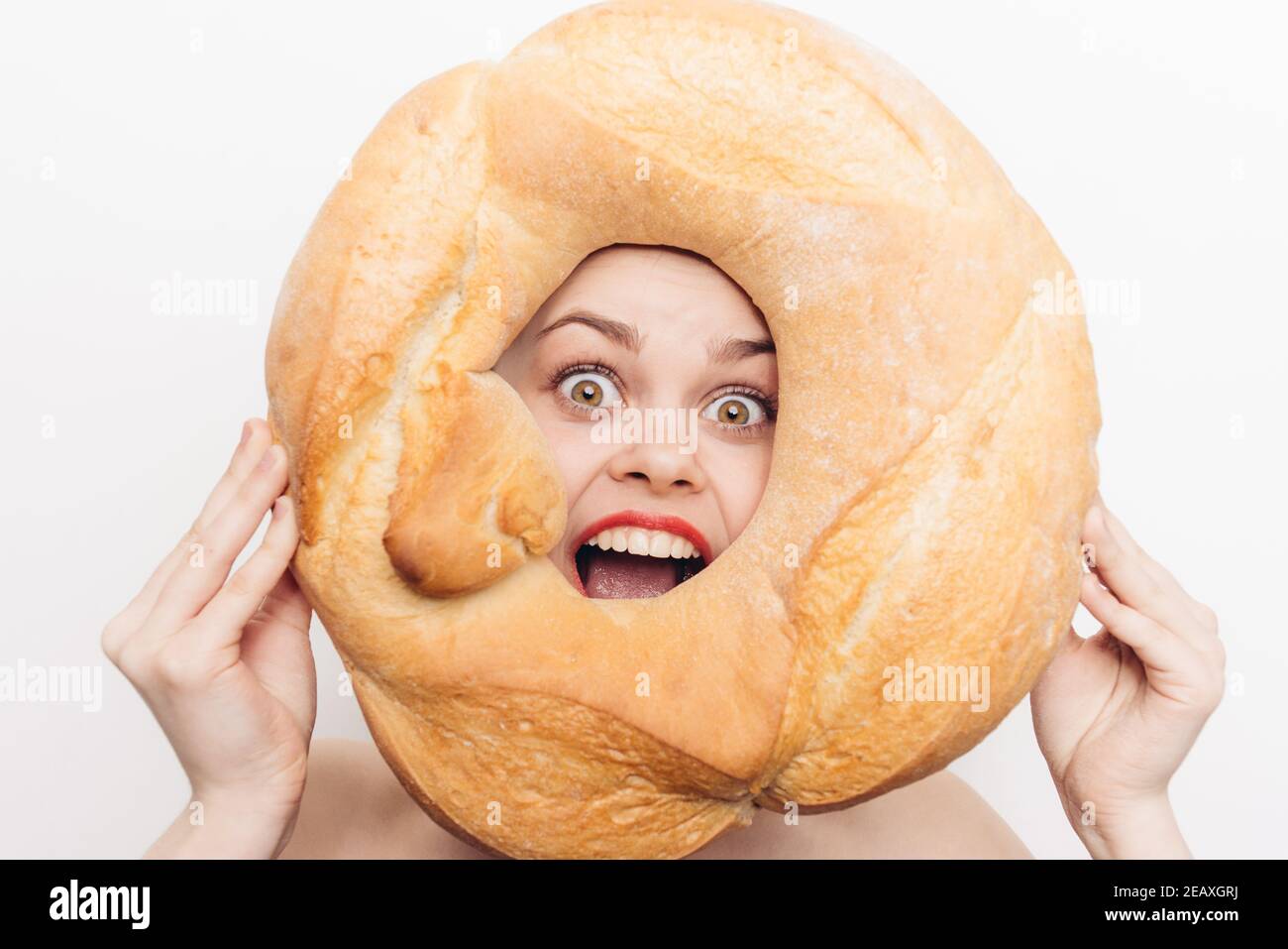 Emotional Woman With Round Loaf Of Bread In Front Of Face And Fun Wide ...