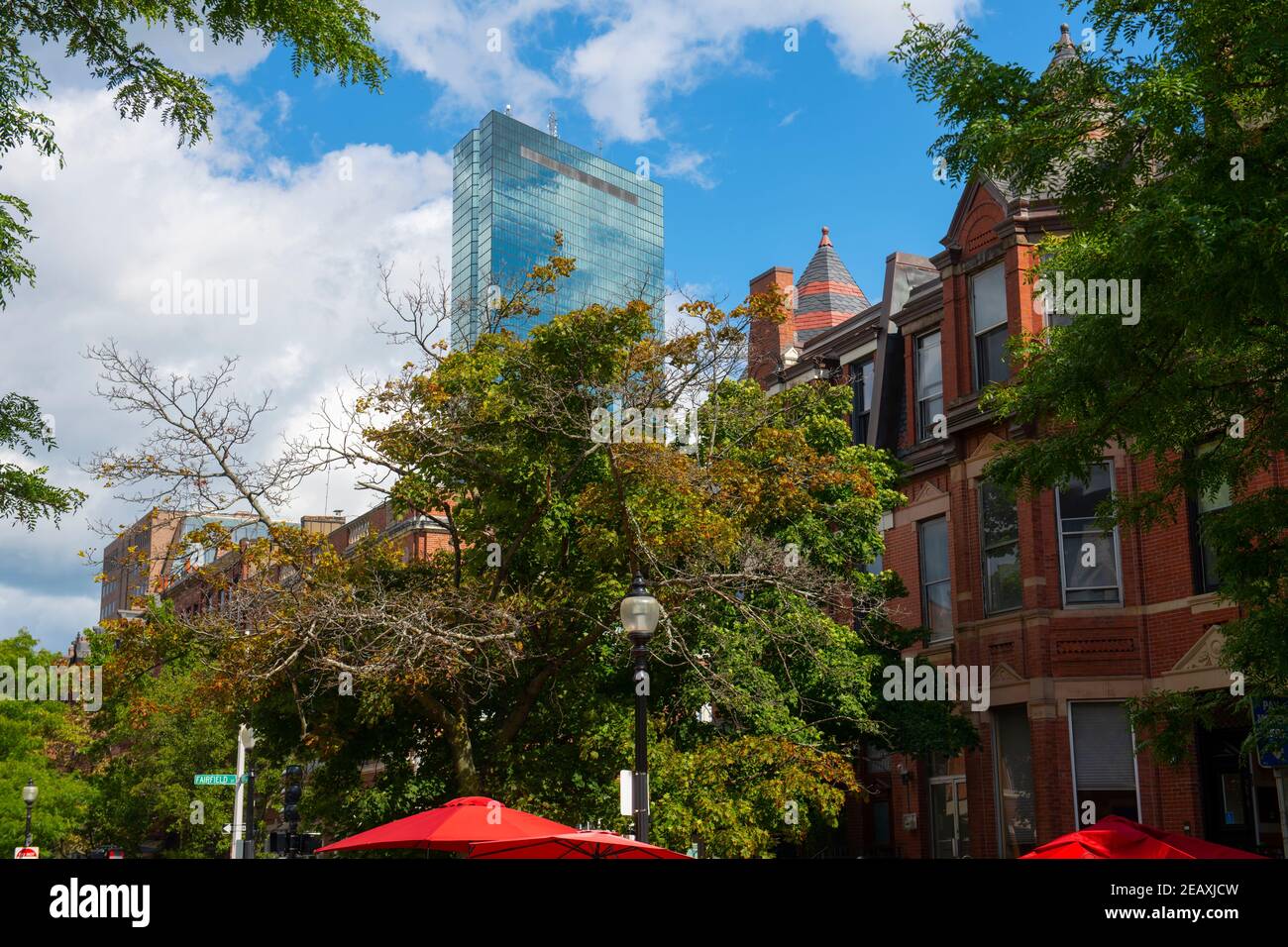Historic commercial buildings on Newbury Street with John Hancock Tower ...